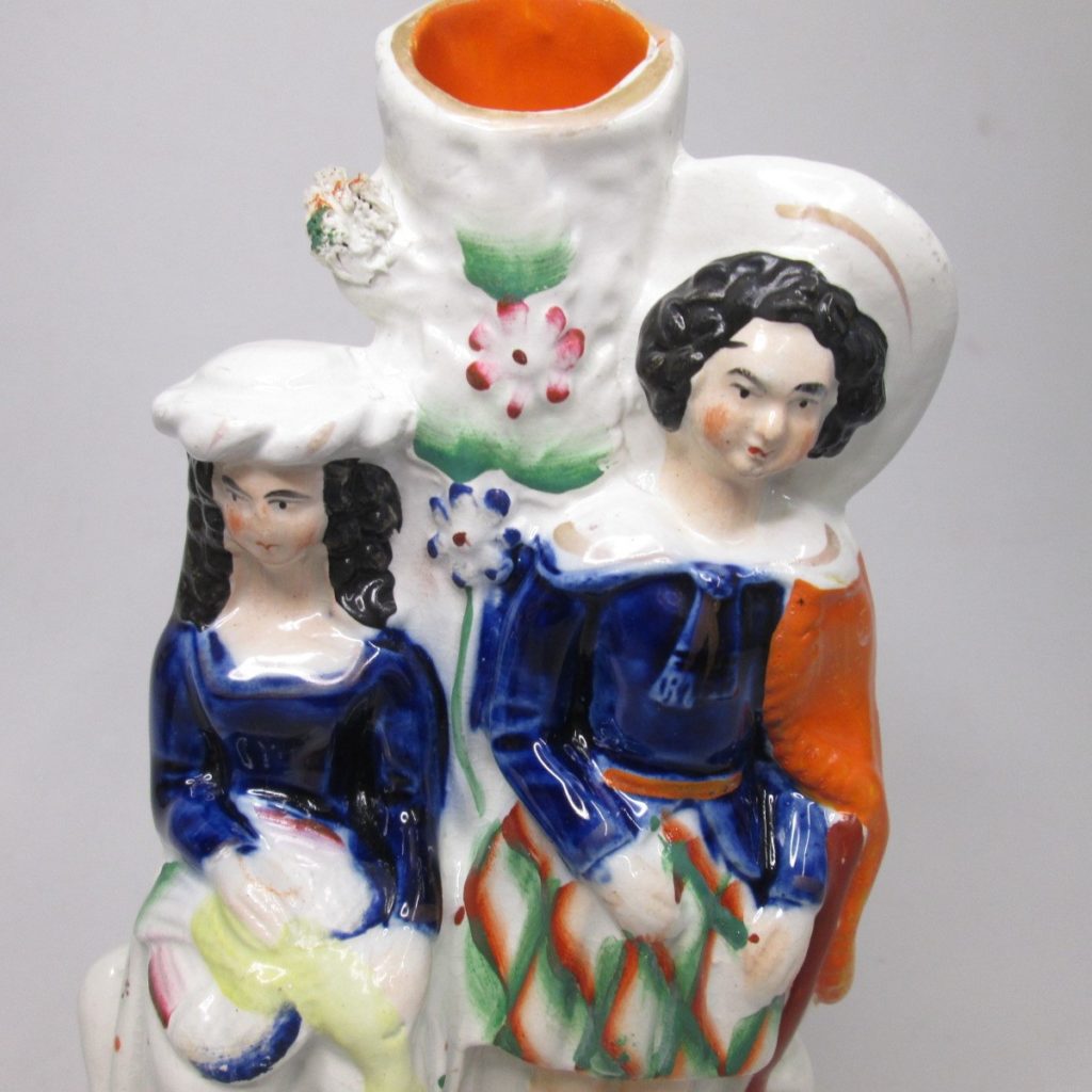 A Staffordshire spill holder group figure of a hunter and companion ...