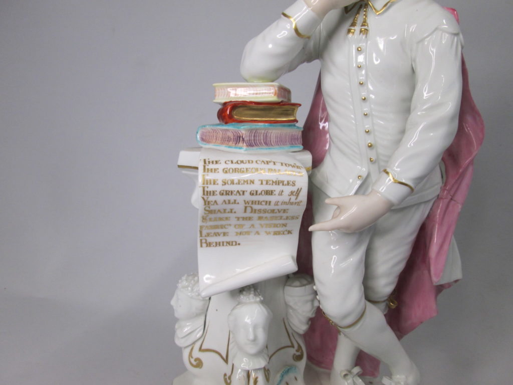 A Derby porcelain figure of William Shakespeare standing on an oval ...