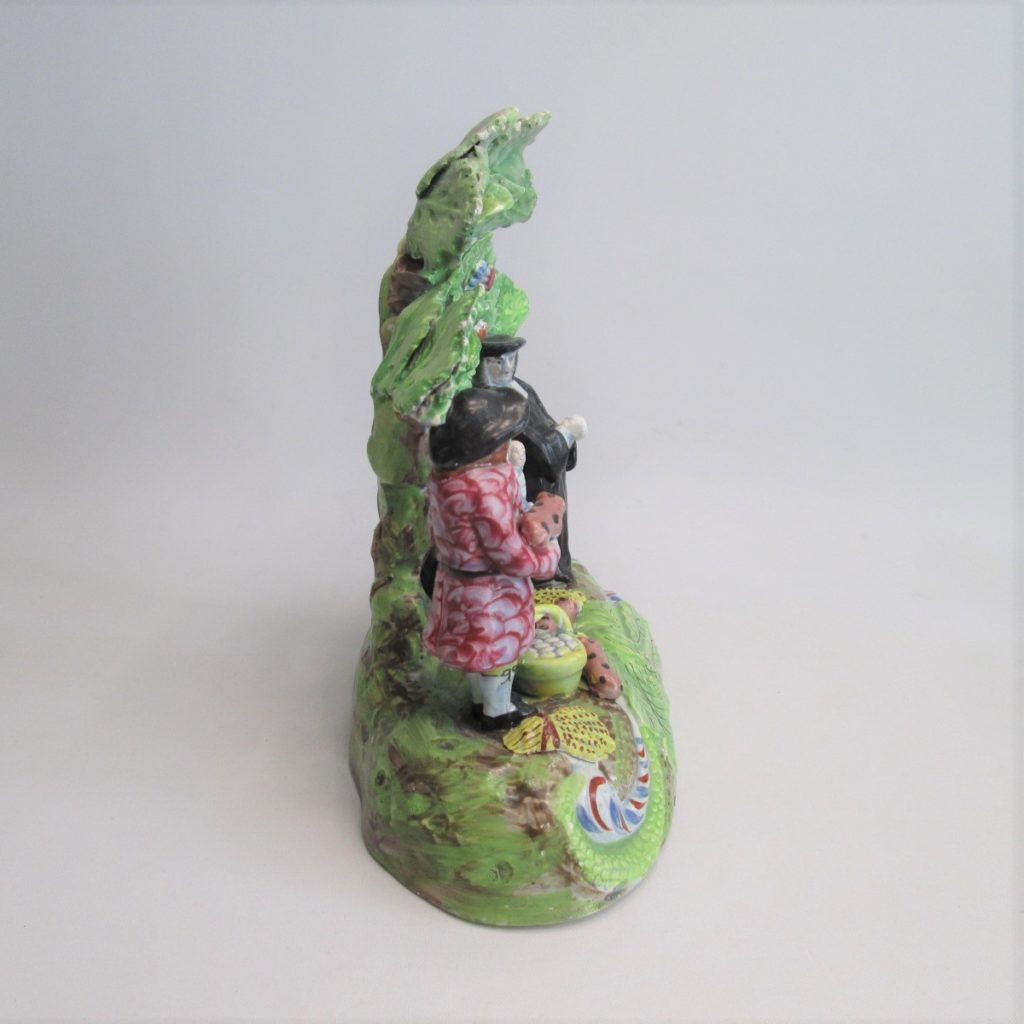 A Staffordshire pearlware ‘Tythe Pig’ group, depicting the farmer ...