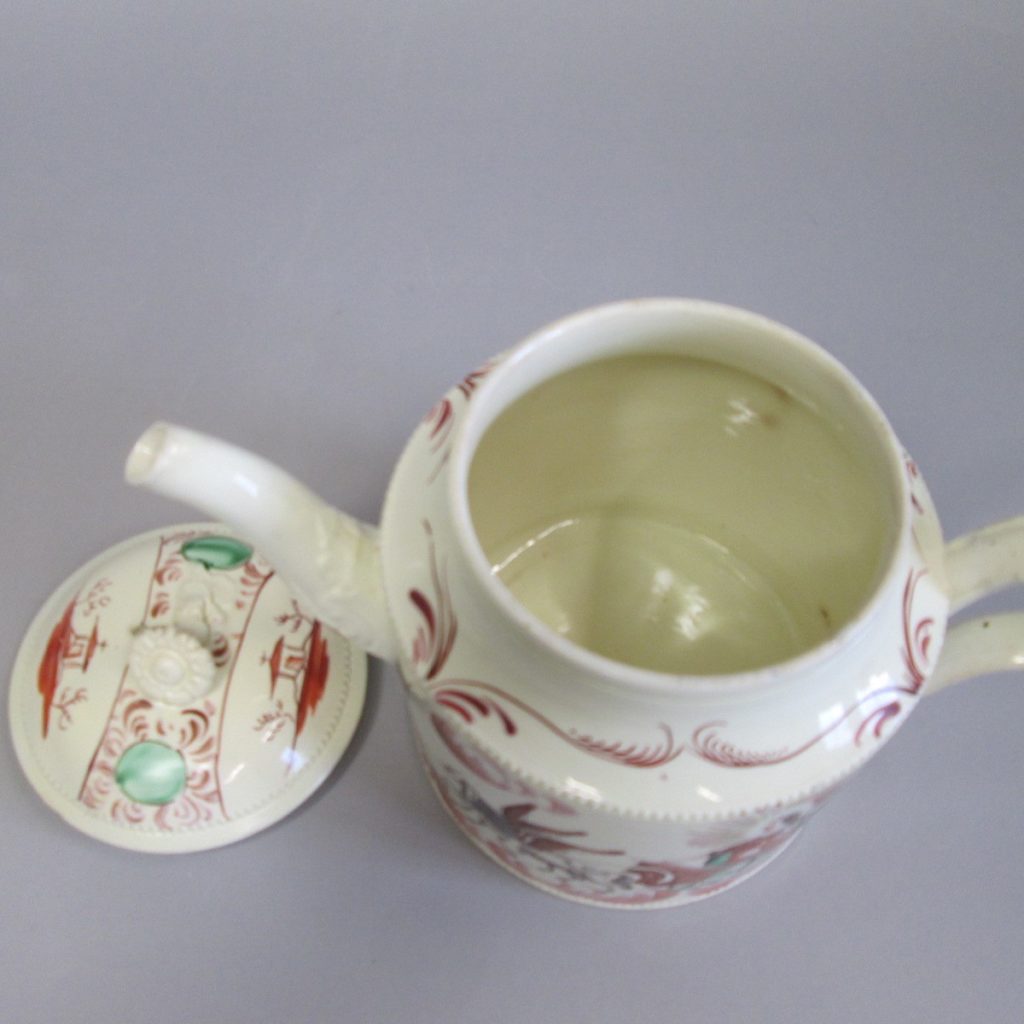 A rare Staffordshire William Greatbatch creamware teapot decorated with ...